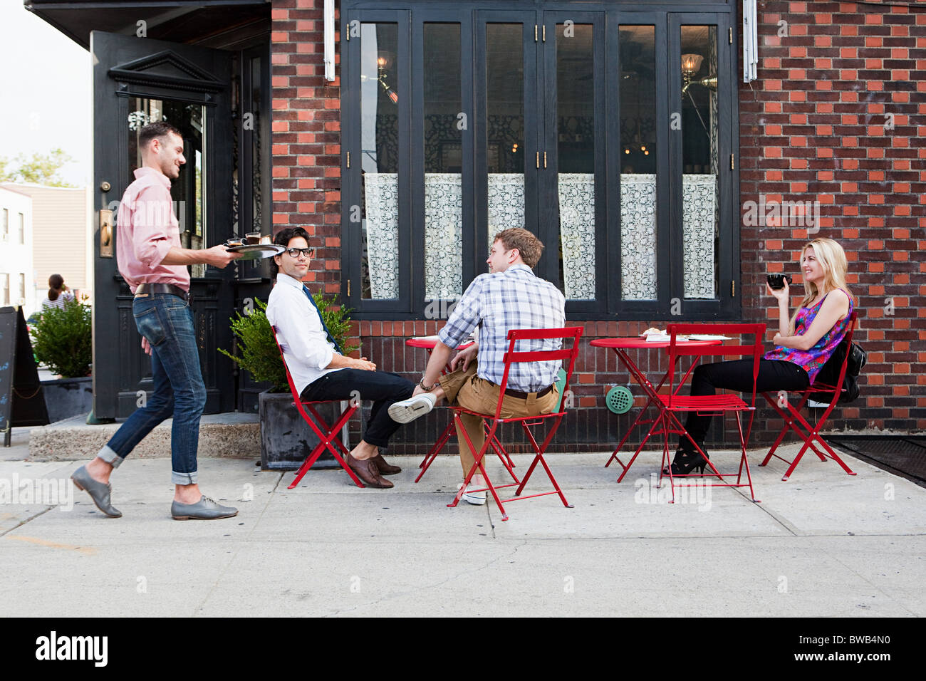 People Sitting Outside Cafe High Resolution Stock Photography and ...