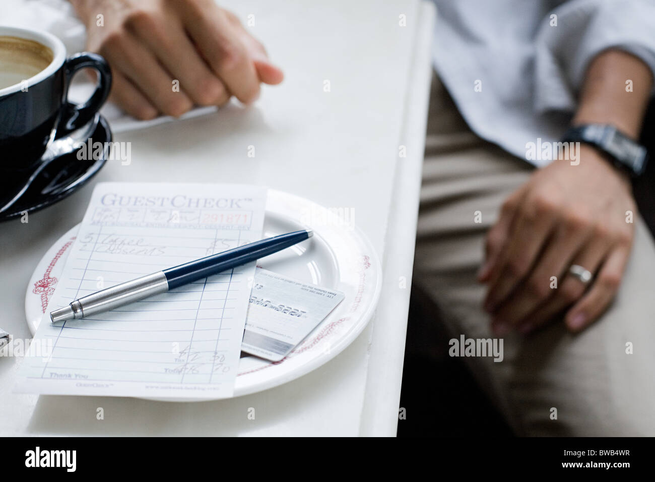 Check on plate at cafe Stock Photo - Alamy