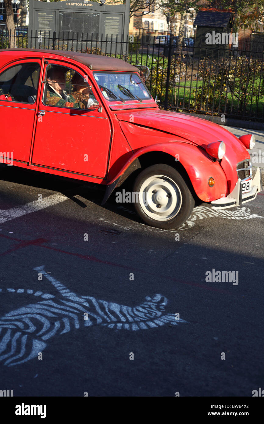 zebra cross zebra graffiti on asphalt and classical car Stock Photo - Alamy