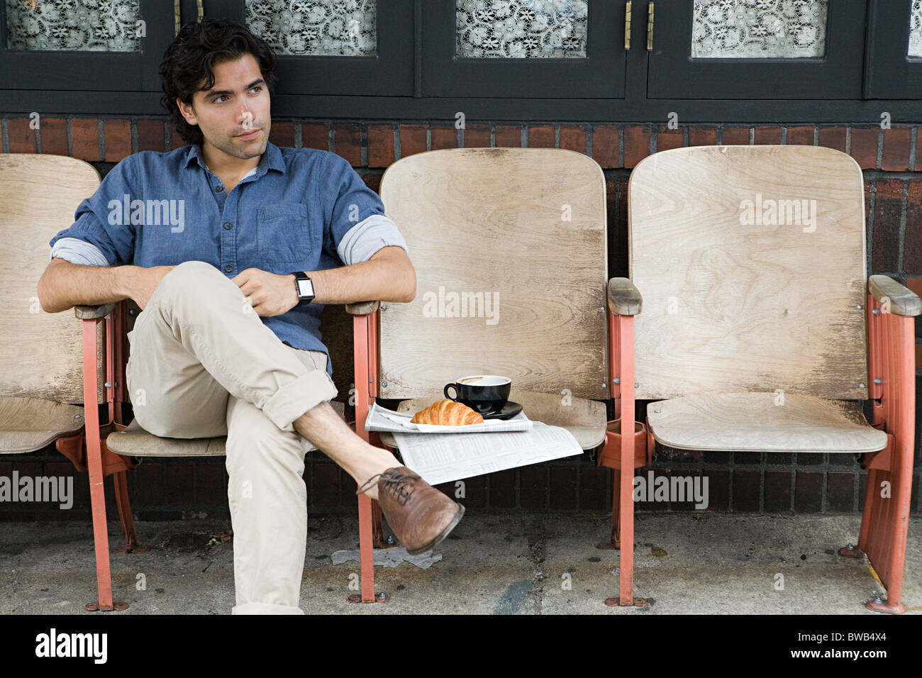 Men sitting outside shop hi-res stock photography and images - Alamy