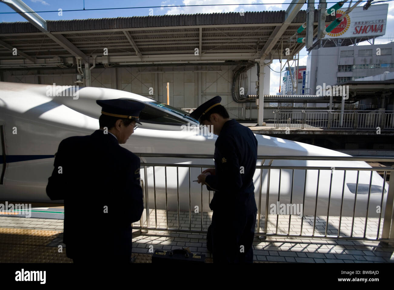 Train driver waiting for the Shinganzen (bullet train) to depart, Tokyo ...