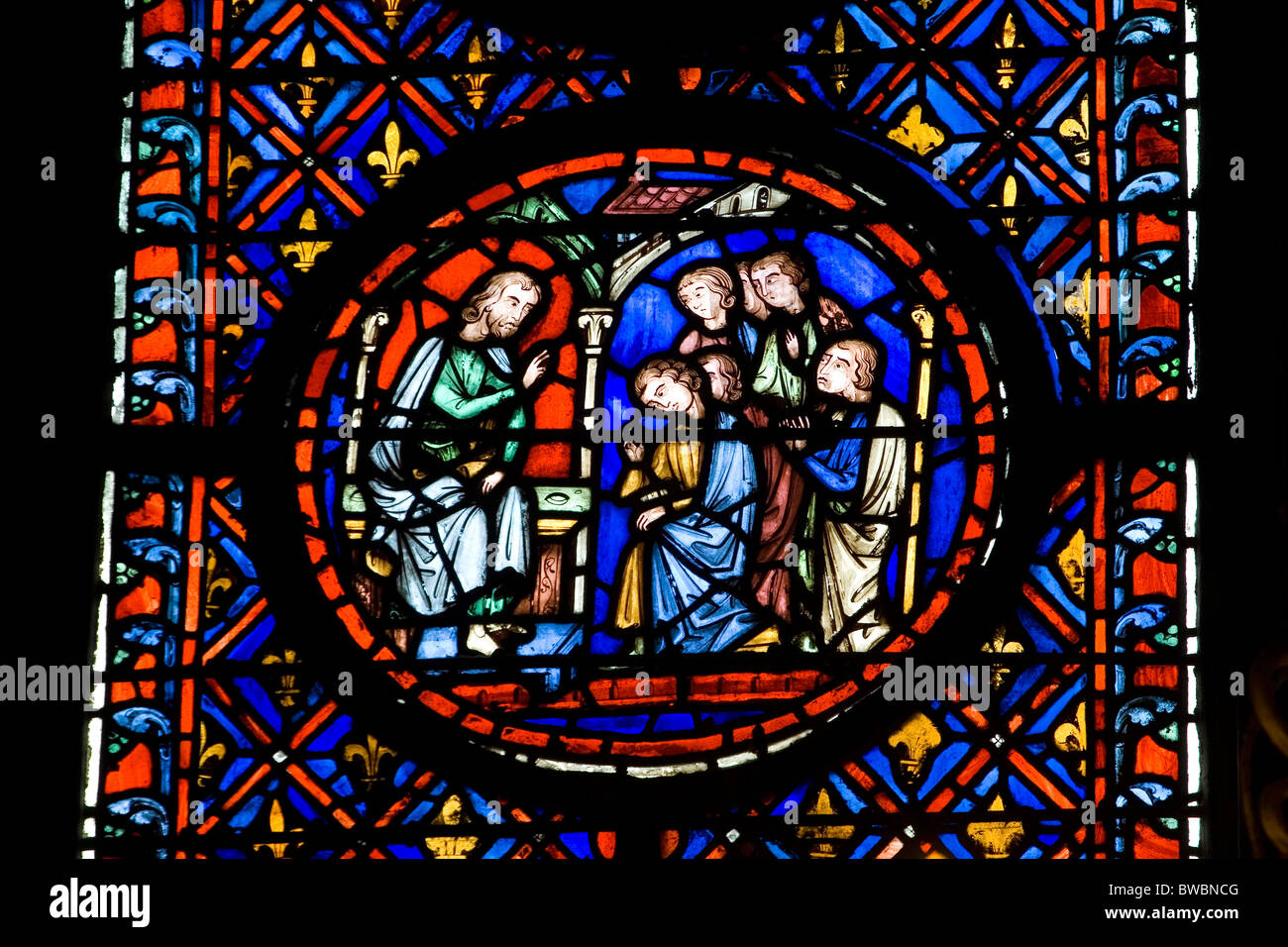 Detail of a stained-glass window depicting biblical scenes in Sainte ...
