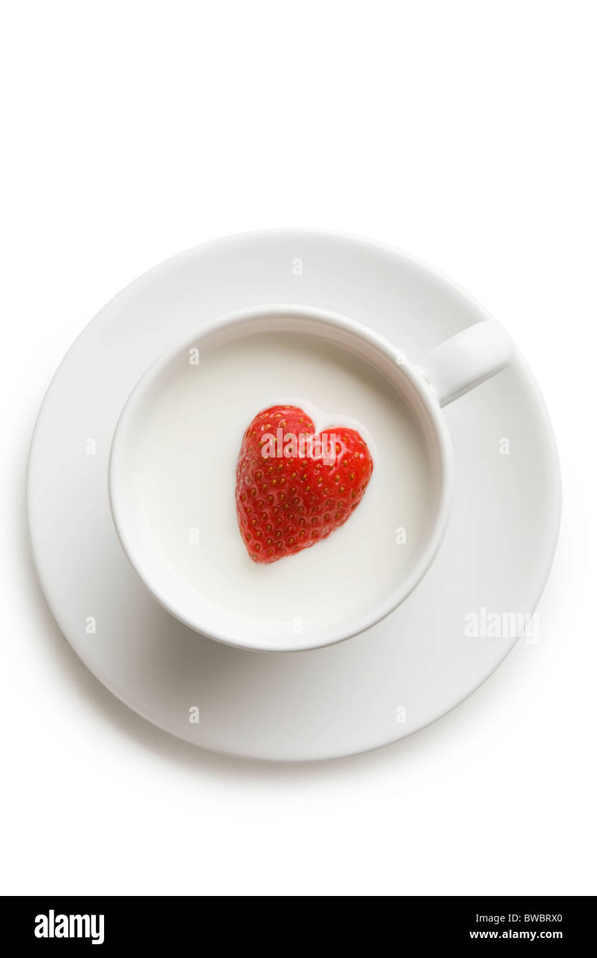 Over view of red ripe strawberry inside cup of milk Stock Photo - Alamy