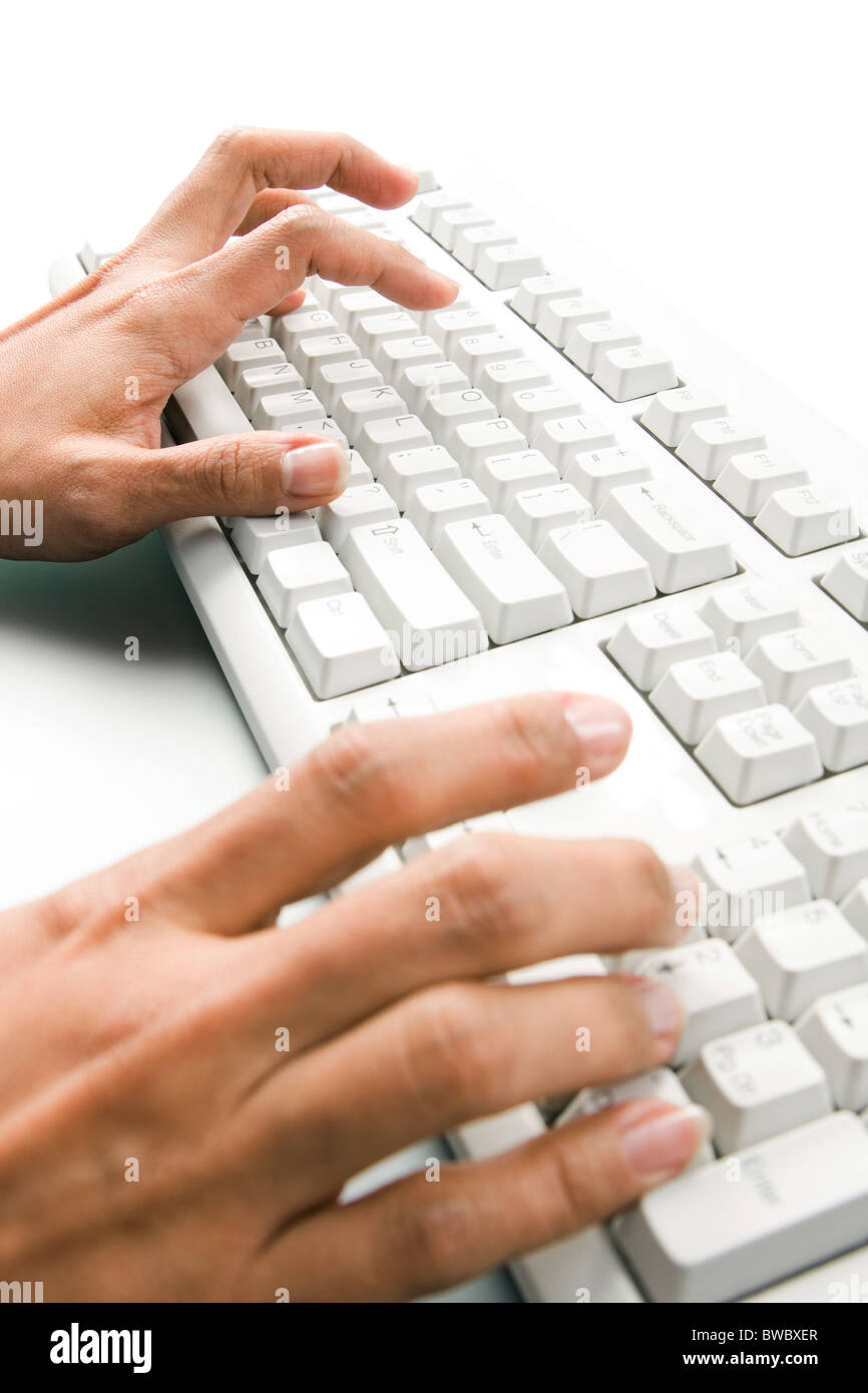 Hacker using keyboard typing Cut Out Stock Images & Pictures - Alamy