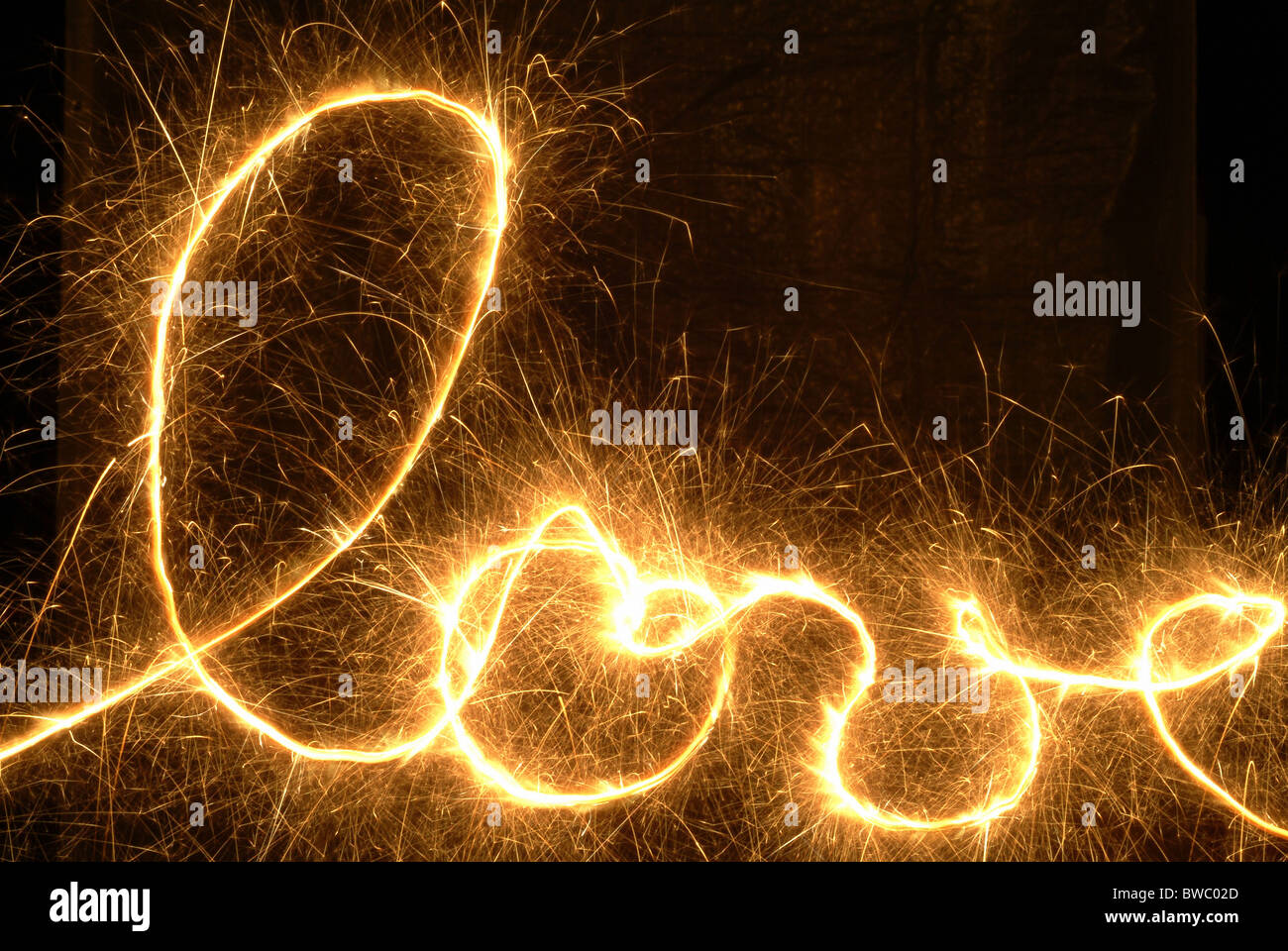 The word Love made of sparklers Stock Photo - Alamy