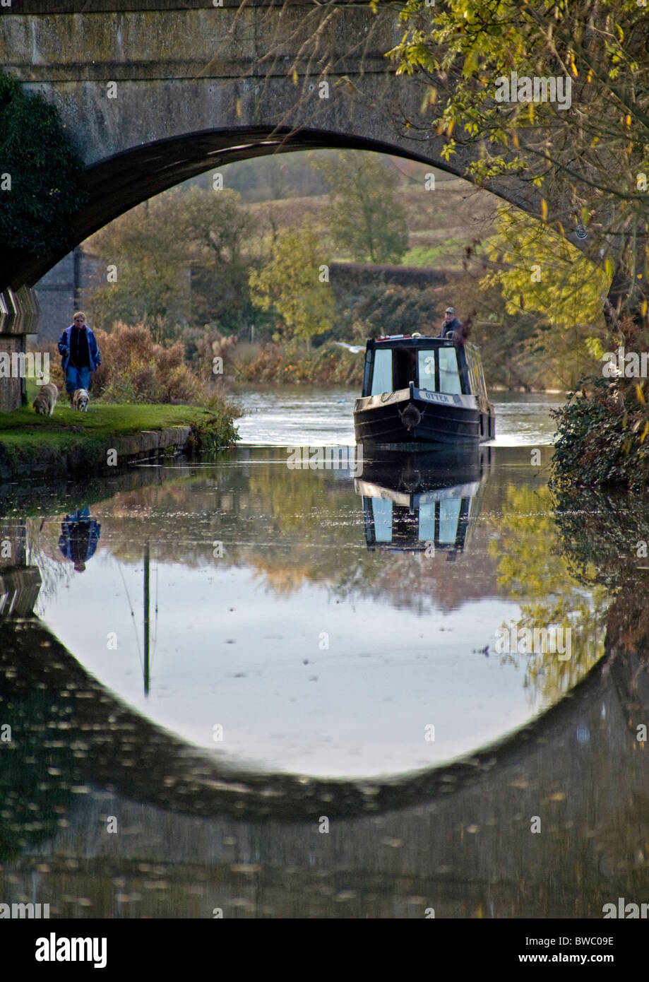 canal boat about to pass under bridge on grand union canal Stock Photo ...