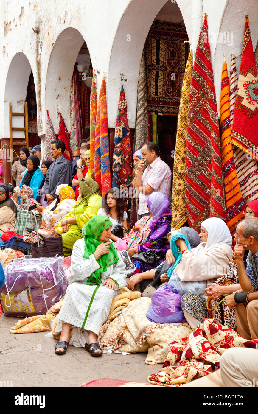 A carpet auction in the Habous Quarter souq of Casablanca, Morocco ...
