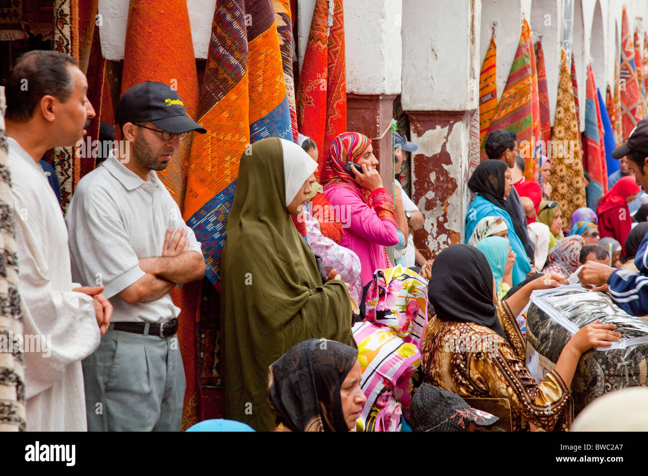 A carpet auction in the Habous Quarter souq of Casablanca, Morocco ...