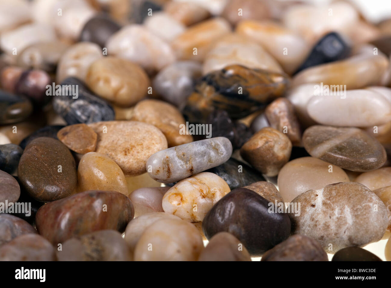 colorful different little stones background Stock Photo - Alamy