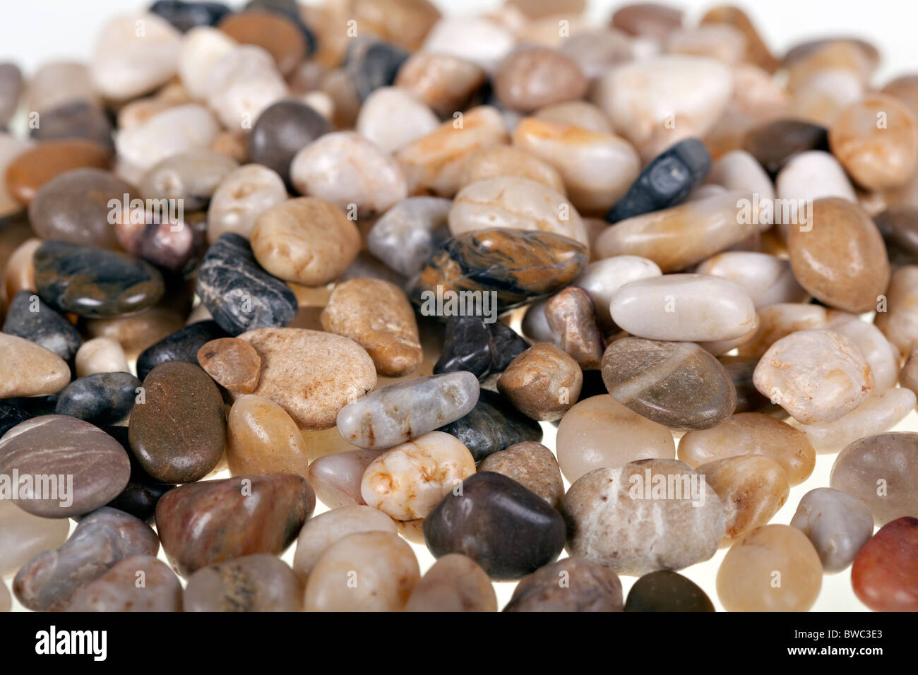 colorful different little stones background Stock Photo - Alamy