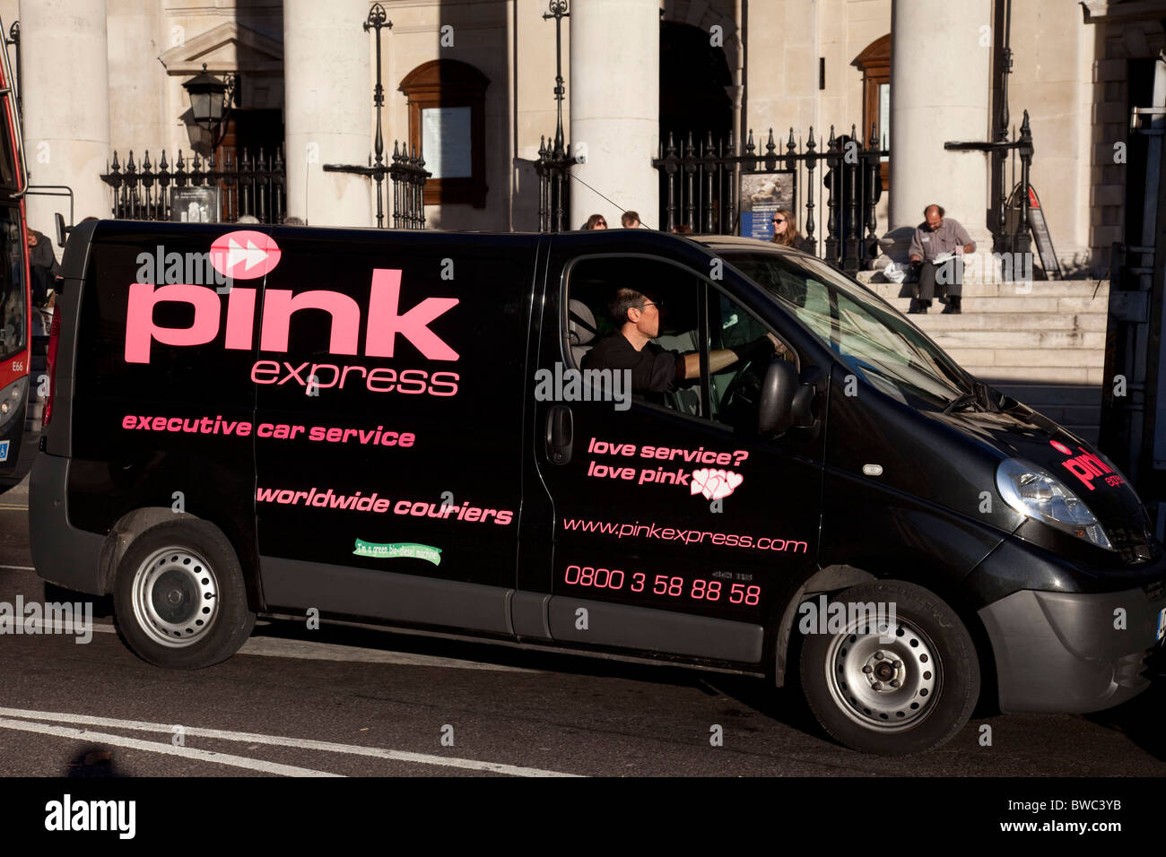 Pink Express courier van drives through London Stock Photo - Alamy