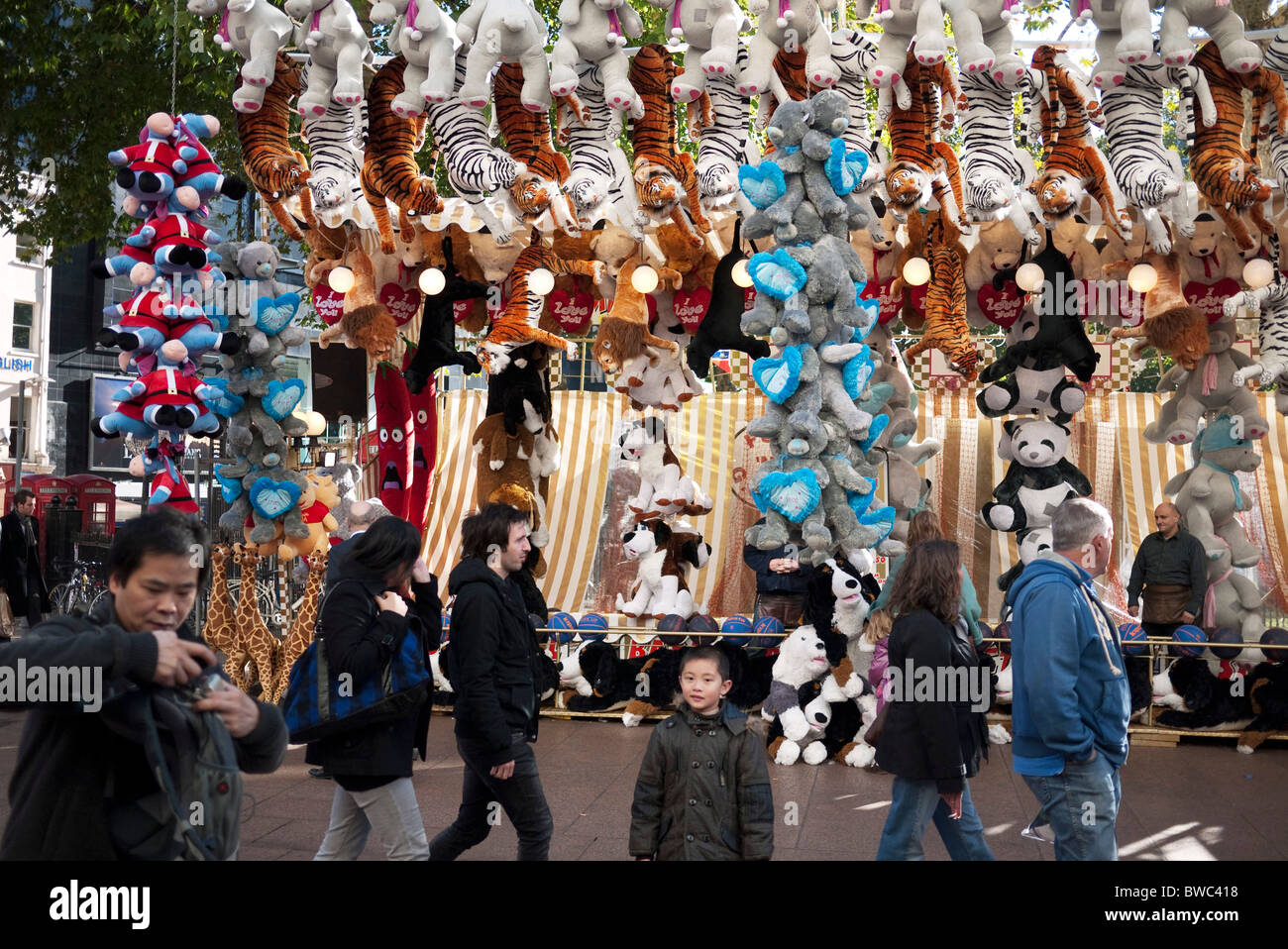 Soft toy prizes at a fun fair stall in Leicester Square, London Stock ...