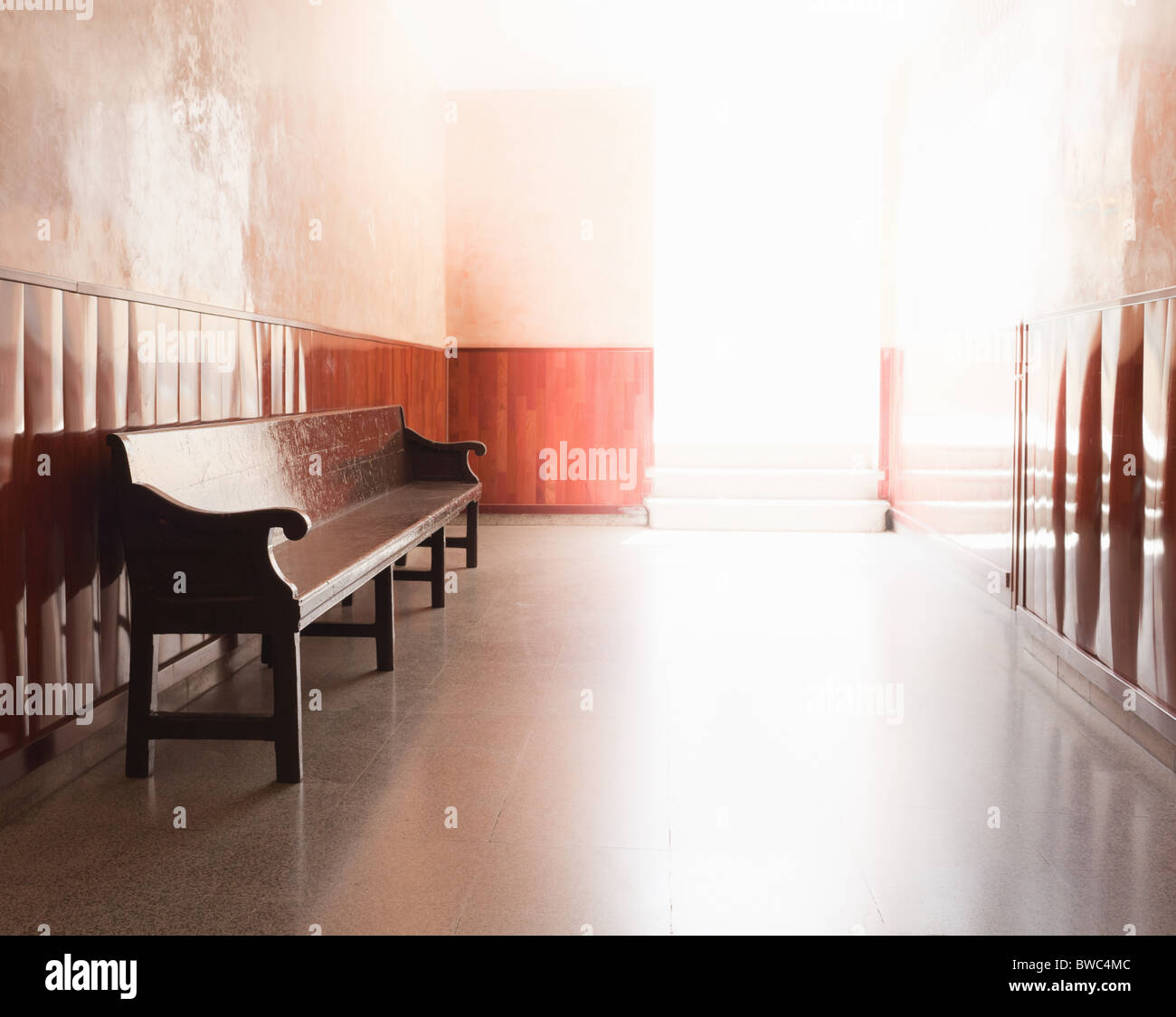 Bench in corridor Stock Photo - Alamy