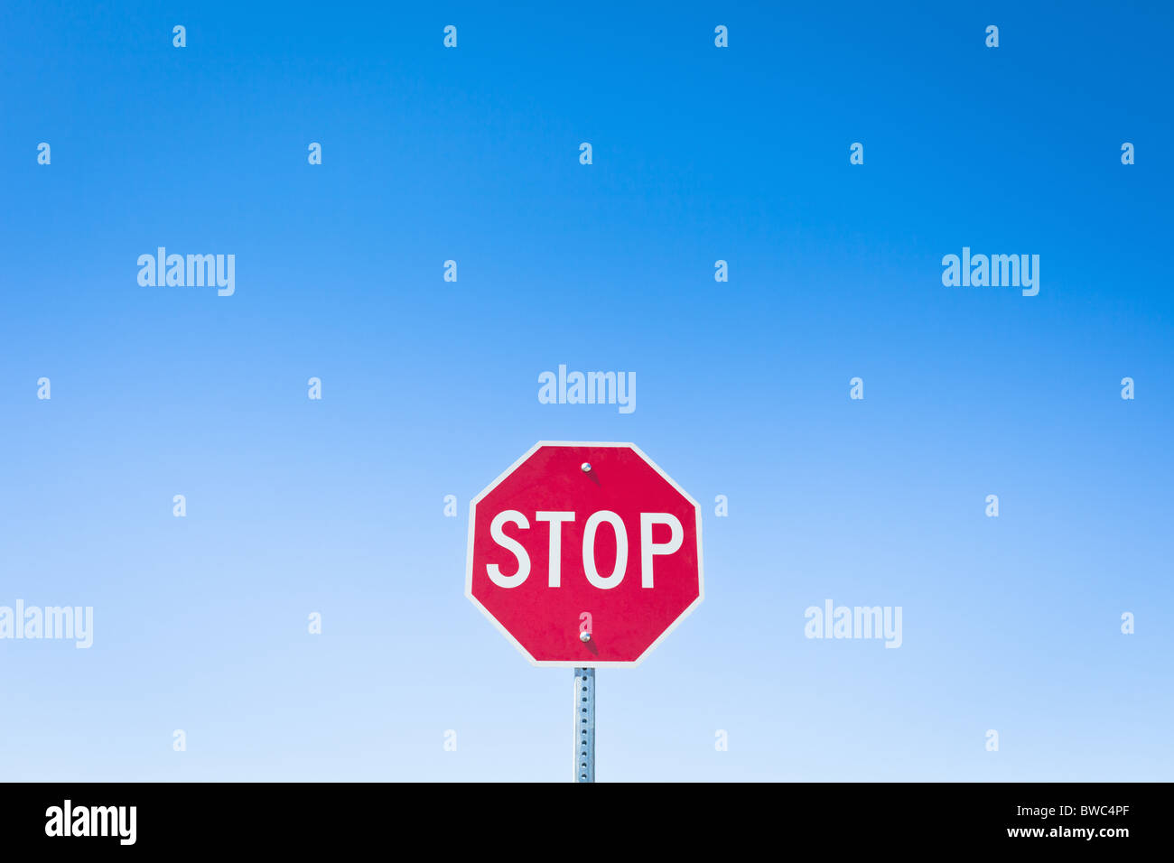 Stop sign against blue sky Stock Photo - Alamy