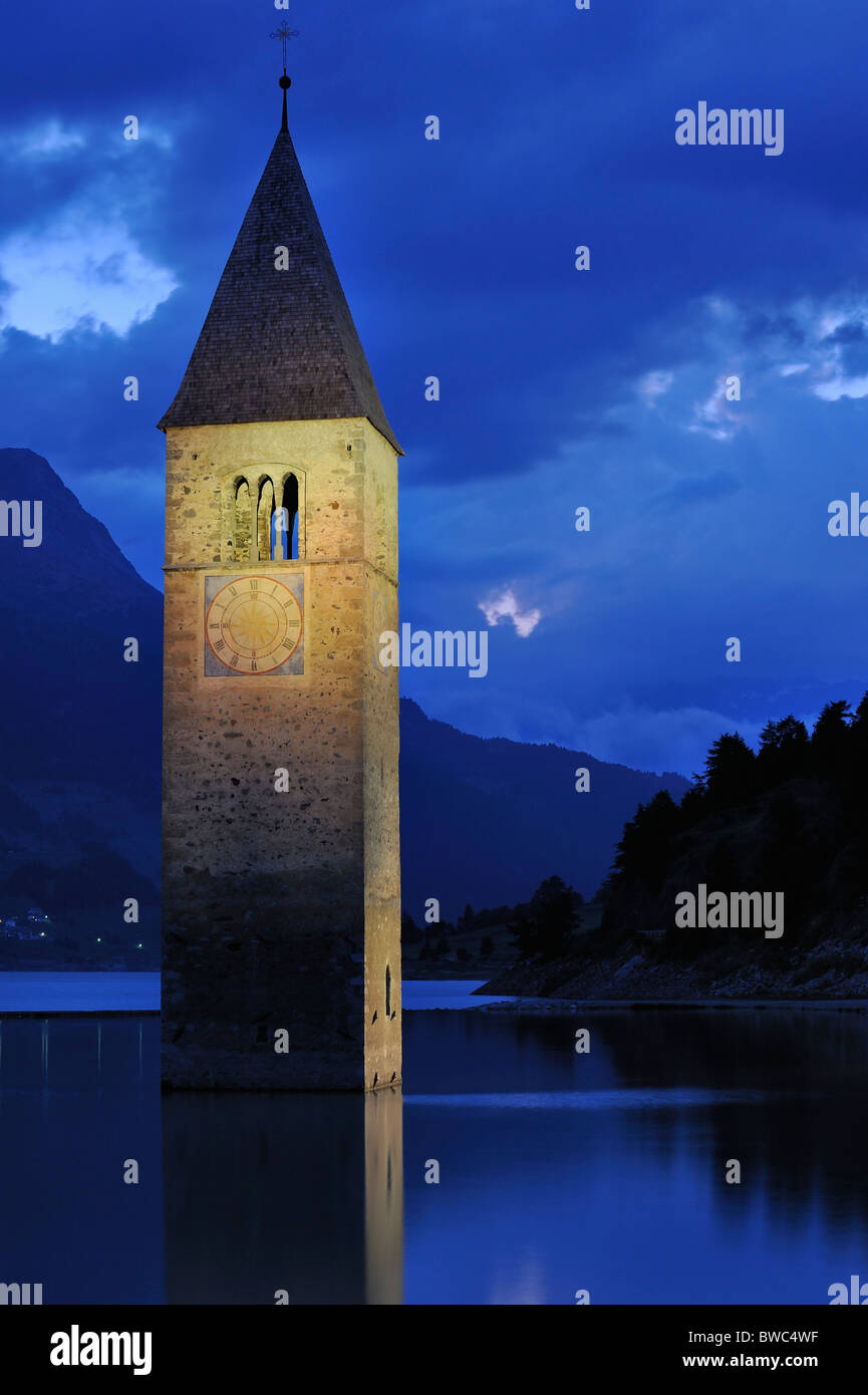 The submerged church tower at night in Lago di Resia at Curon Venosta ...