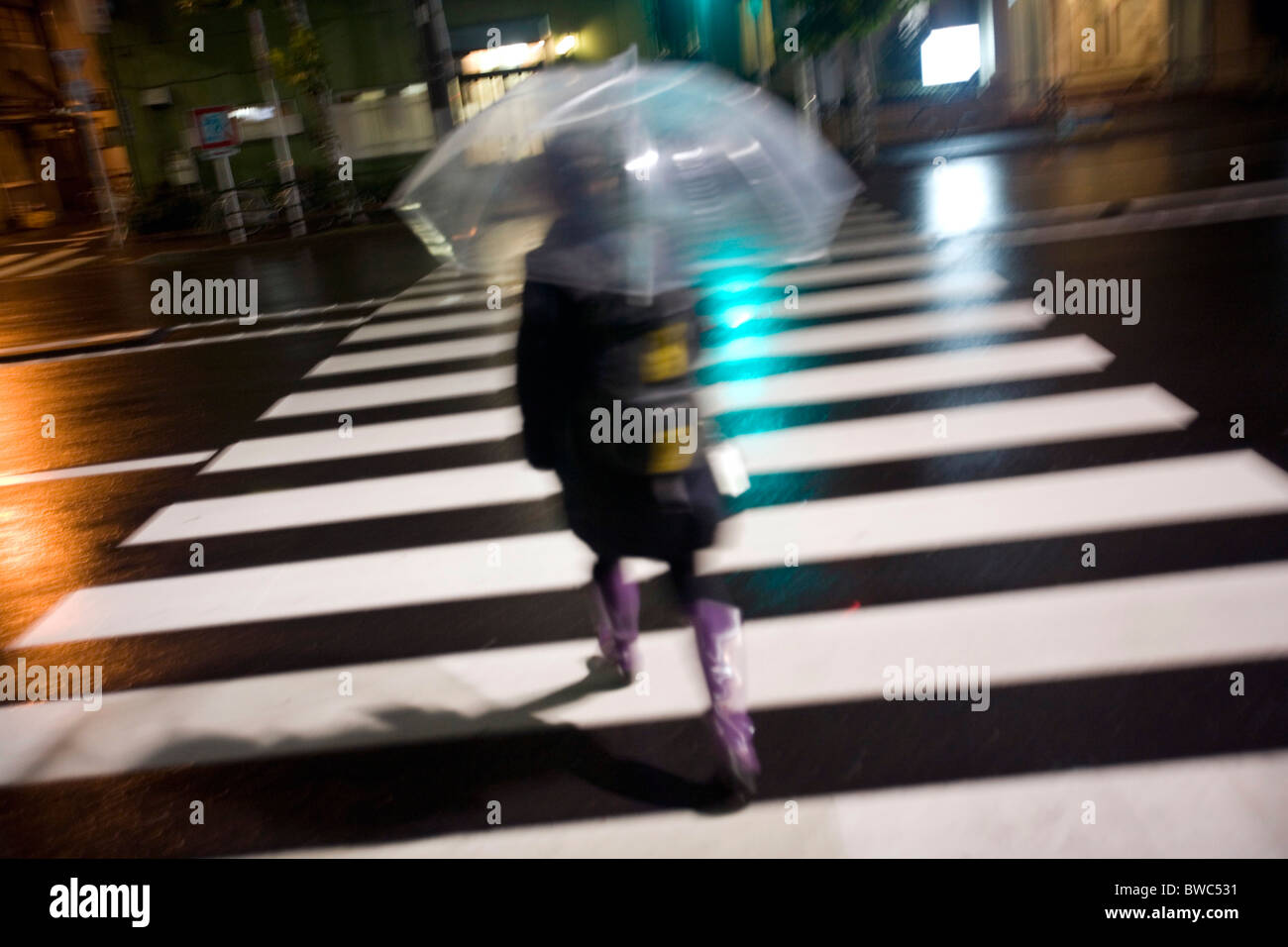 Crossing the zebra line at night Stock Photo - Alamy