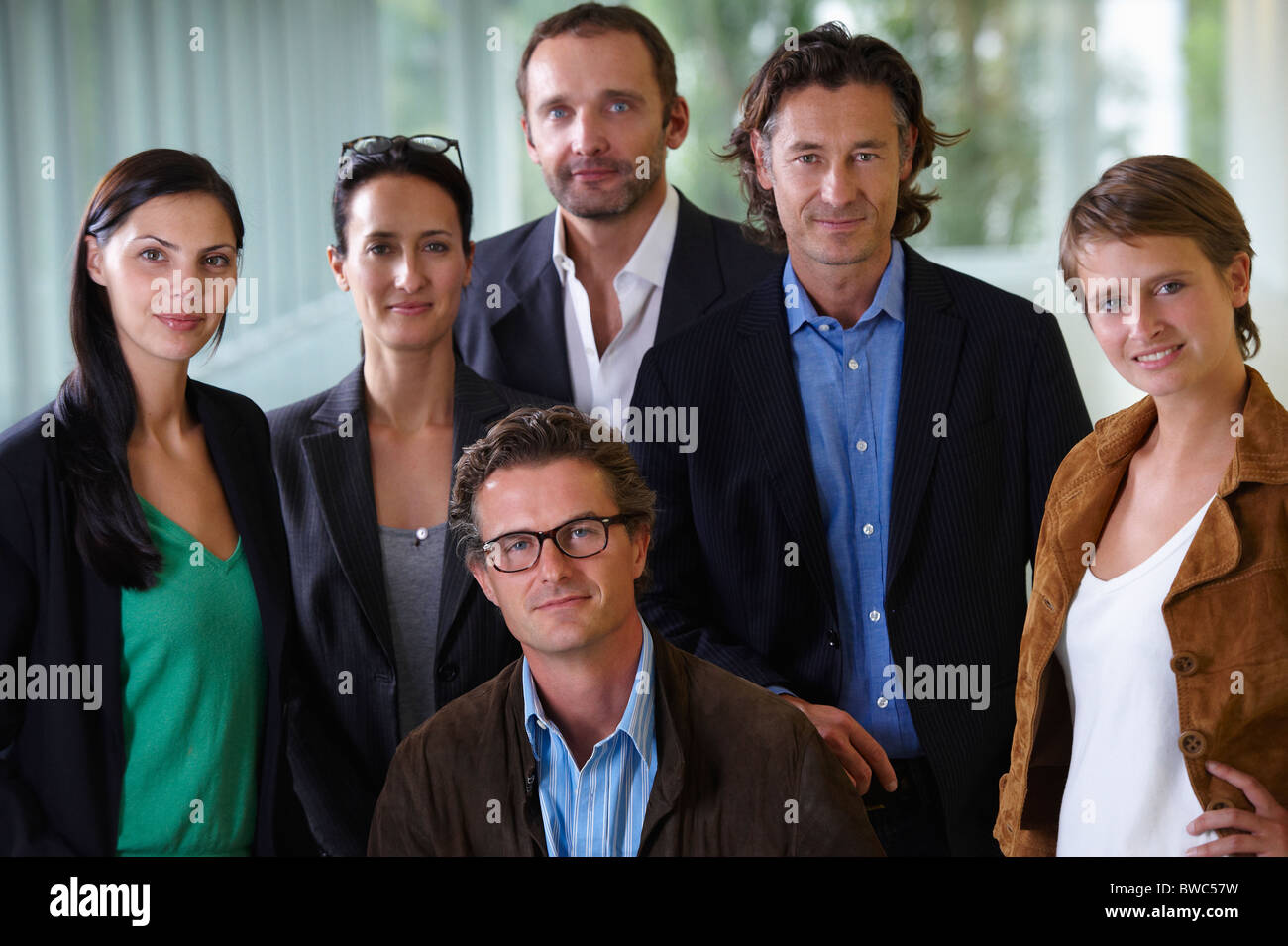 Portrait of business team smiling Stock Photo - Alamy