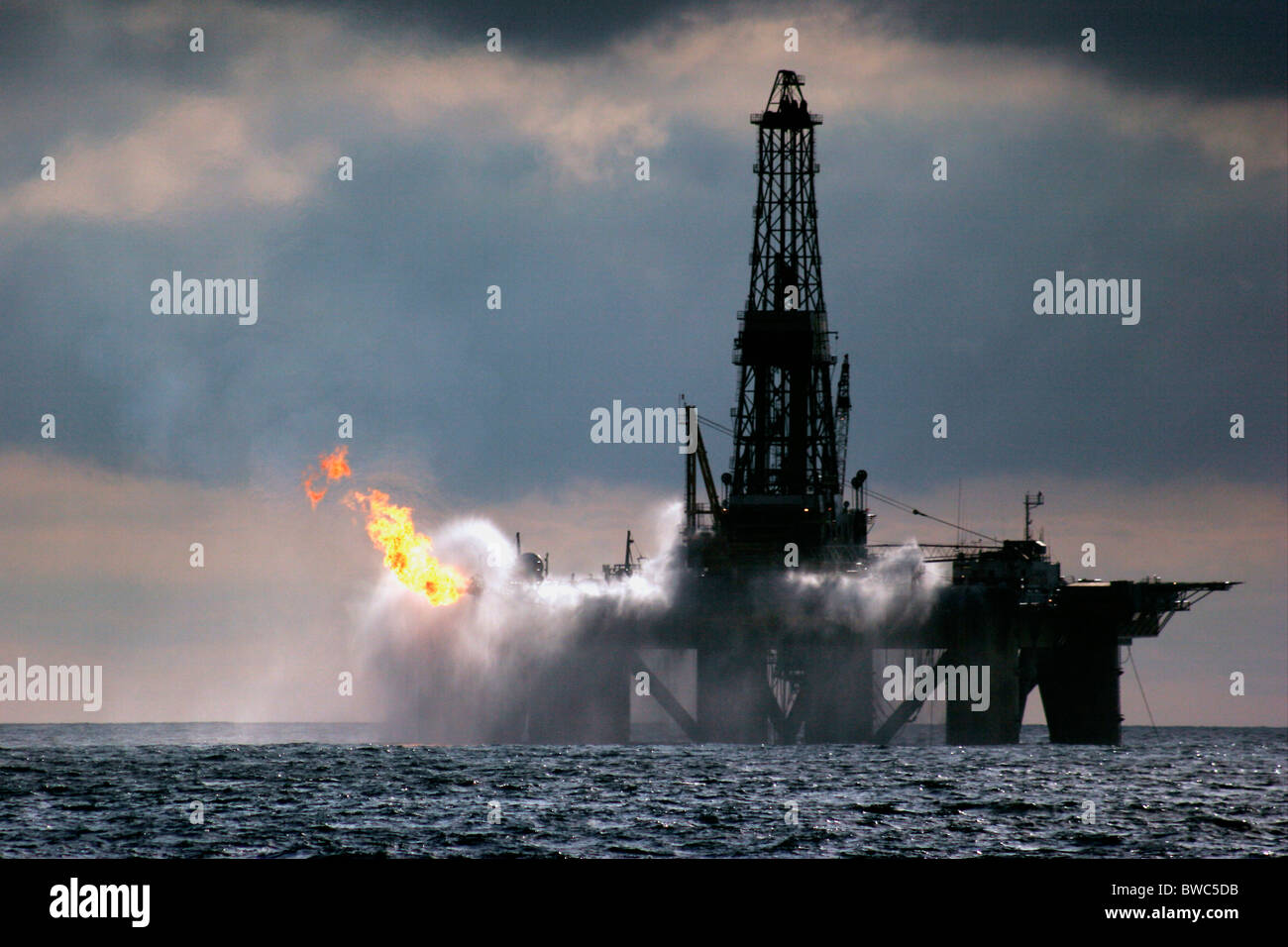 The oil rig J.W McLean flares off gas during drilling operations in the ...