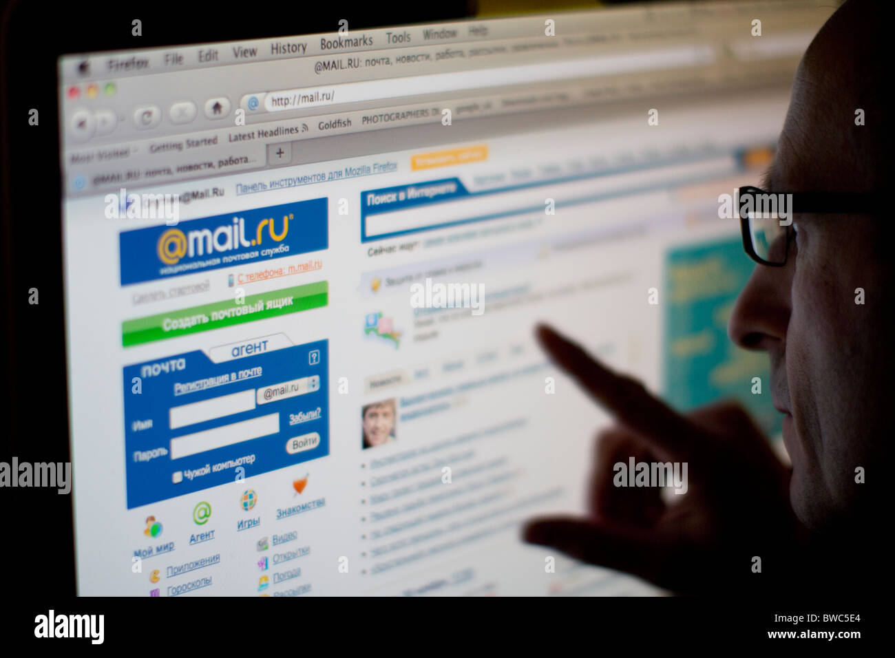 Male looking at website of mail.ru, Russian internet company Stock ...