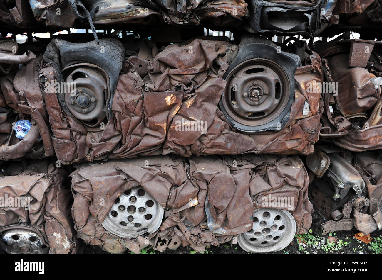 Scrapped cars crushed Stock Photo - Alamy
