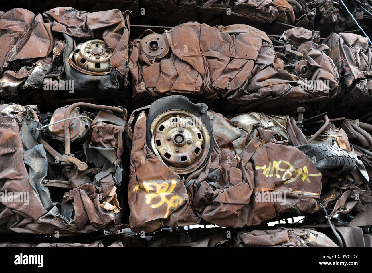 Scrapped cars crushed Stock Photo - Alamy