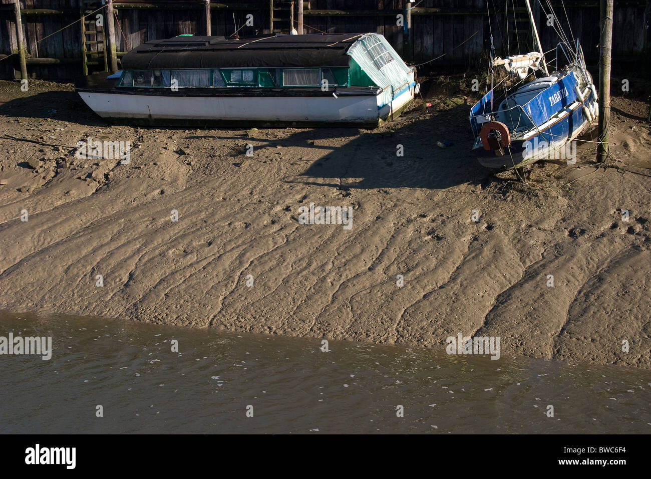 silted river bank and bed in bright winter sunshine Stock Photo - Alamy