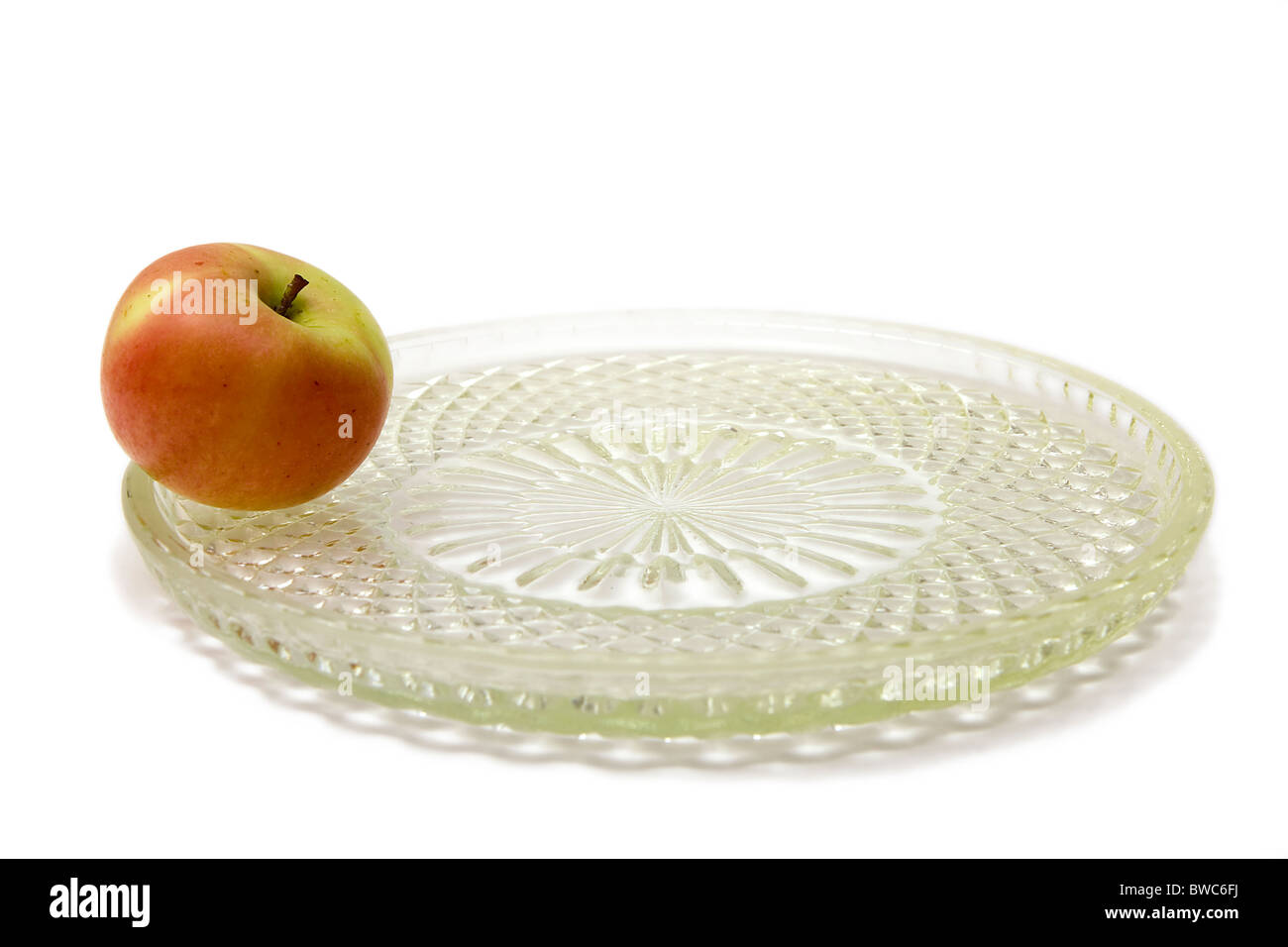 Unique apple on the big plate on a white background Stock Photo - Alamy