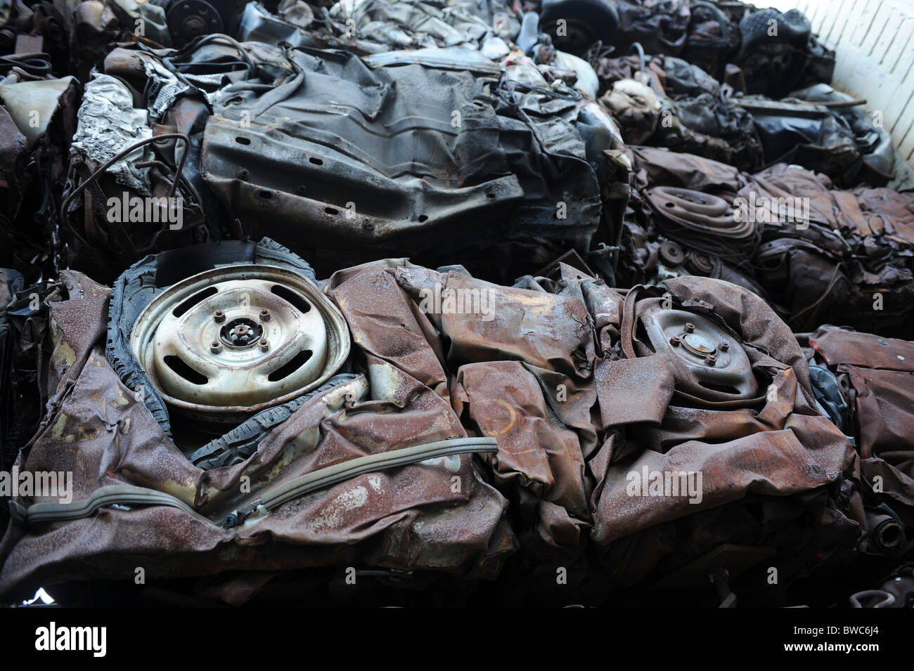 Scrapped cars crushed Stock Photo - Alamy