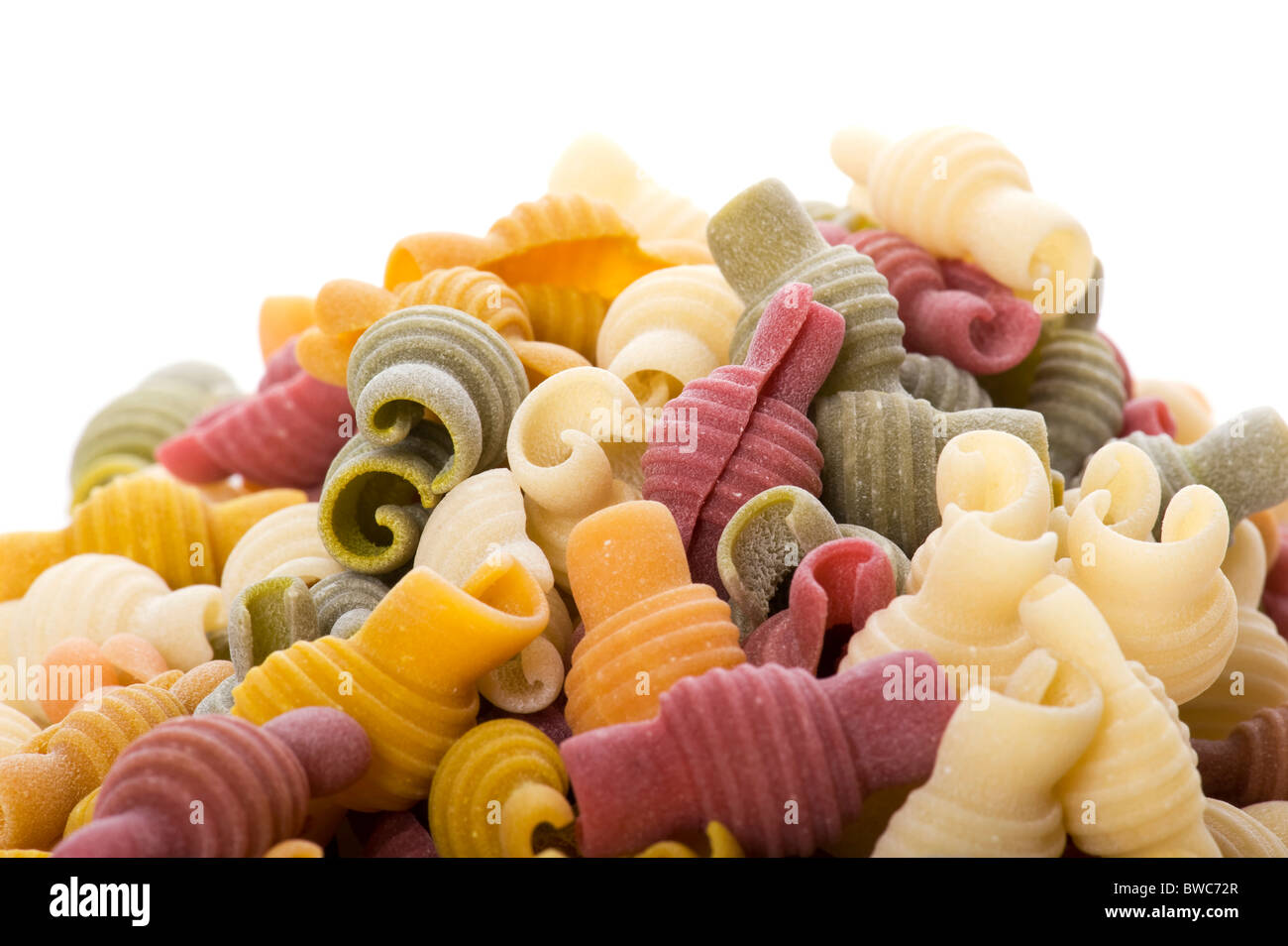 object on white - food colored pasta close up Stock Photo - Alamy