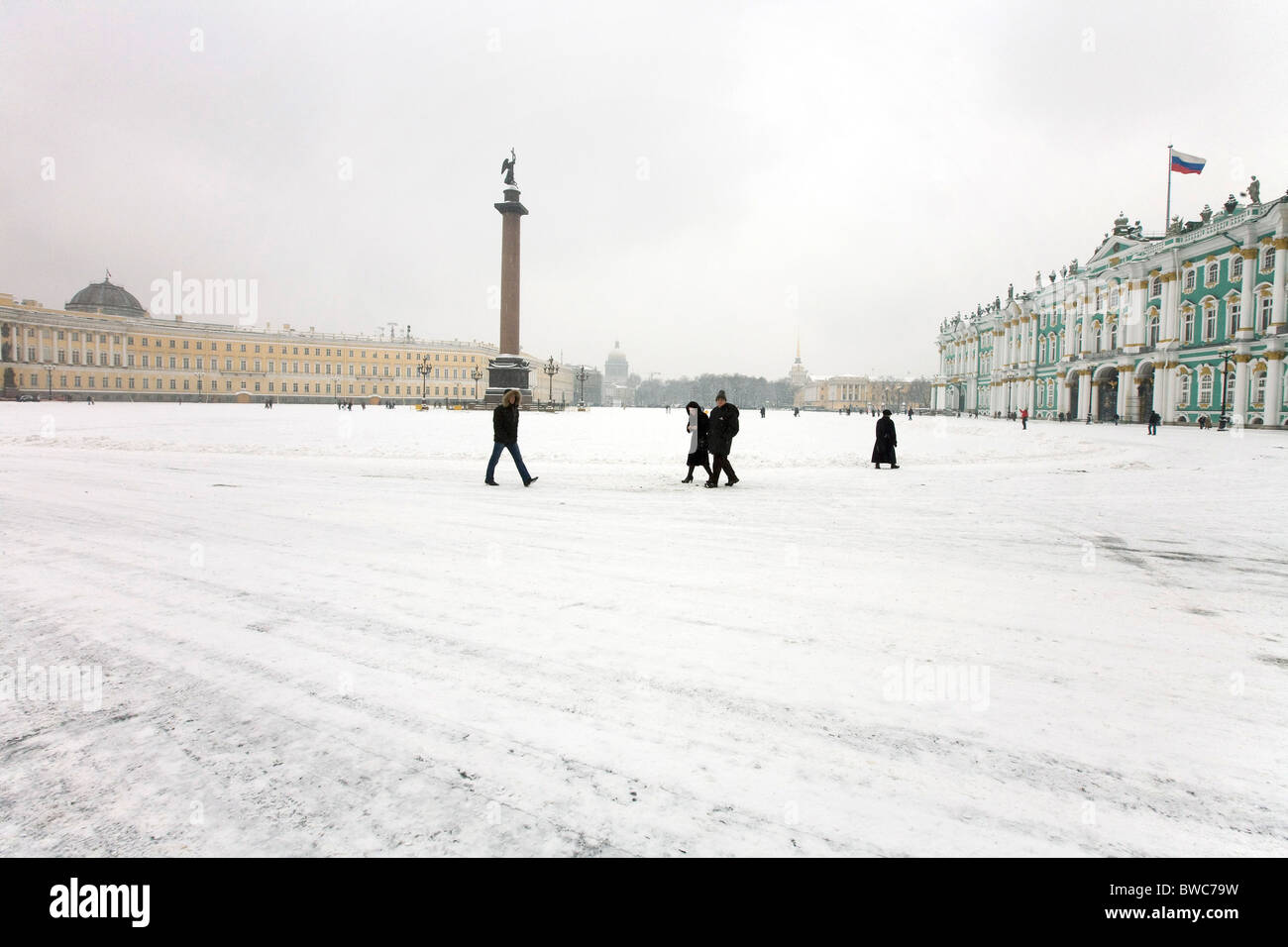 PPeople walking on Palace Square in Snow, with Alexander's Column and ...