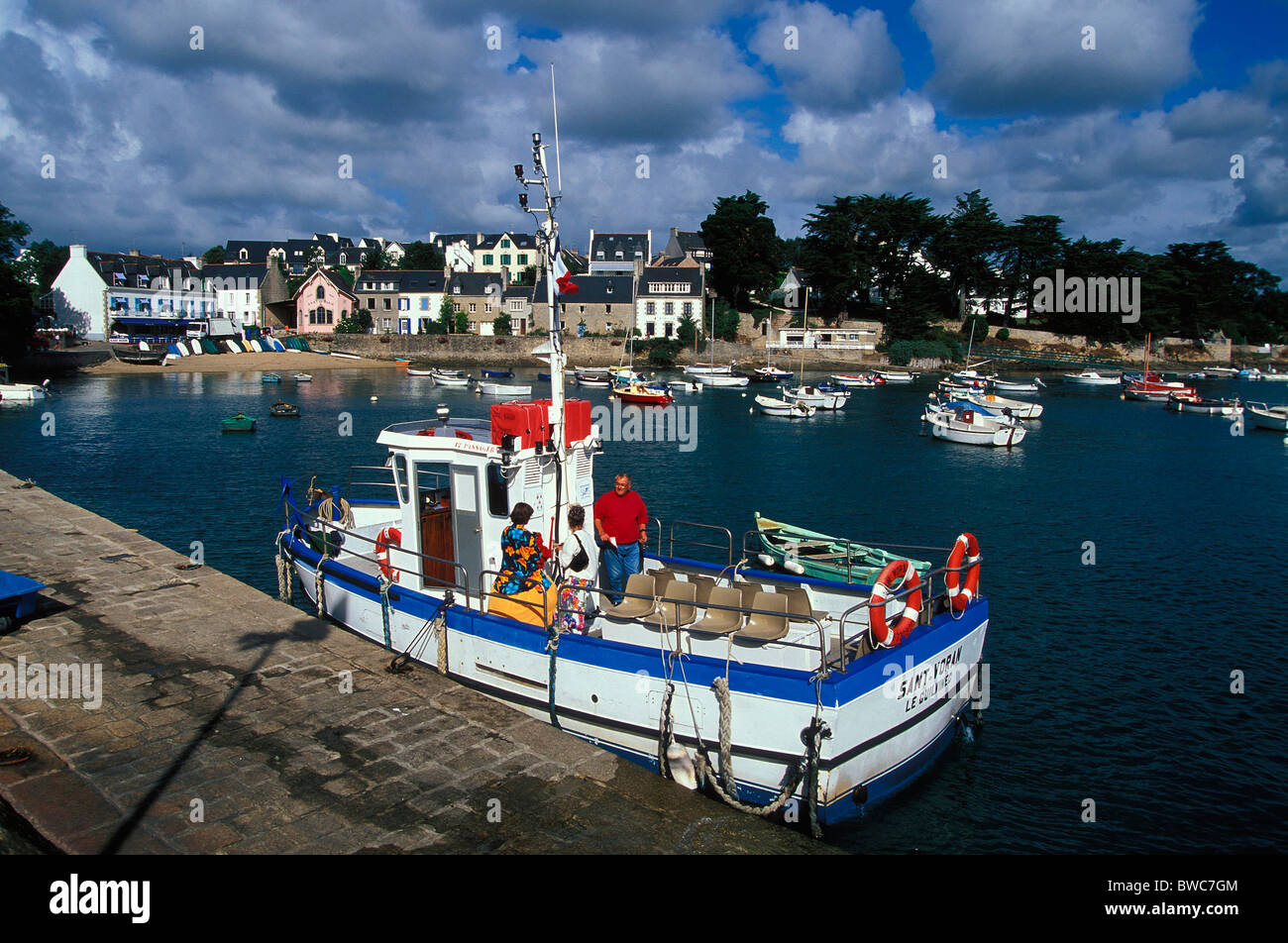 Tourist boat moored alongside quay in Le Port de Sainte-Marine, Finistere, Brittany, France ...