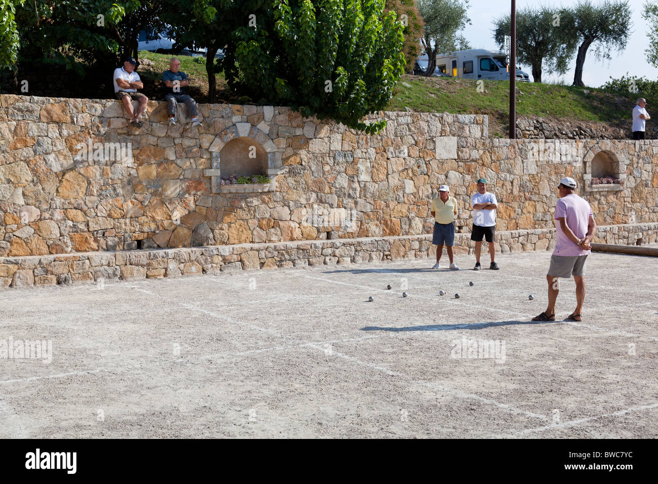 Players contemplate their next move during a game of boules, France ...