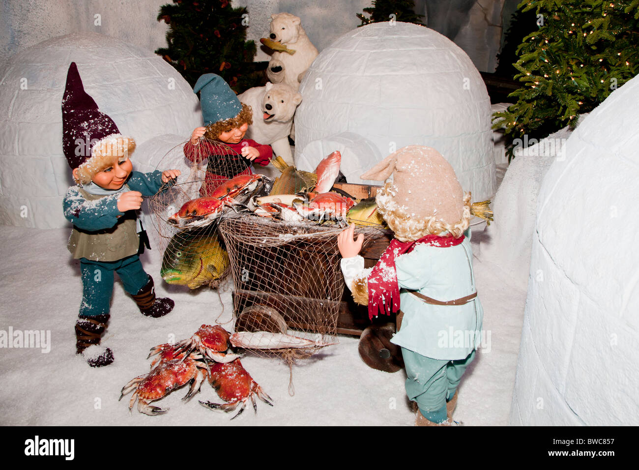 Pixie figures catching fish Stock Photo - Alamy