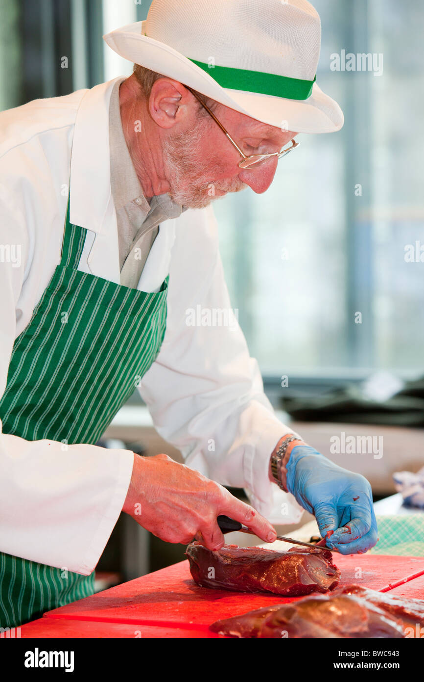 A local venison butcher at Kendal college explains to catering students ...