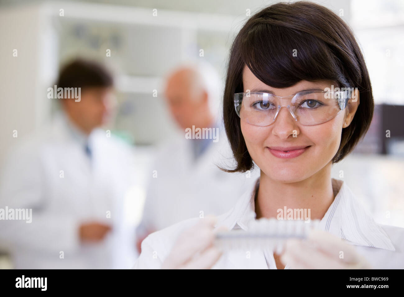 Young smiling female scientist hi-res stock photography and images - Alamy