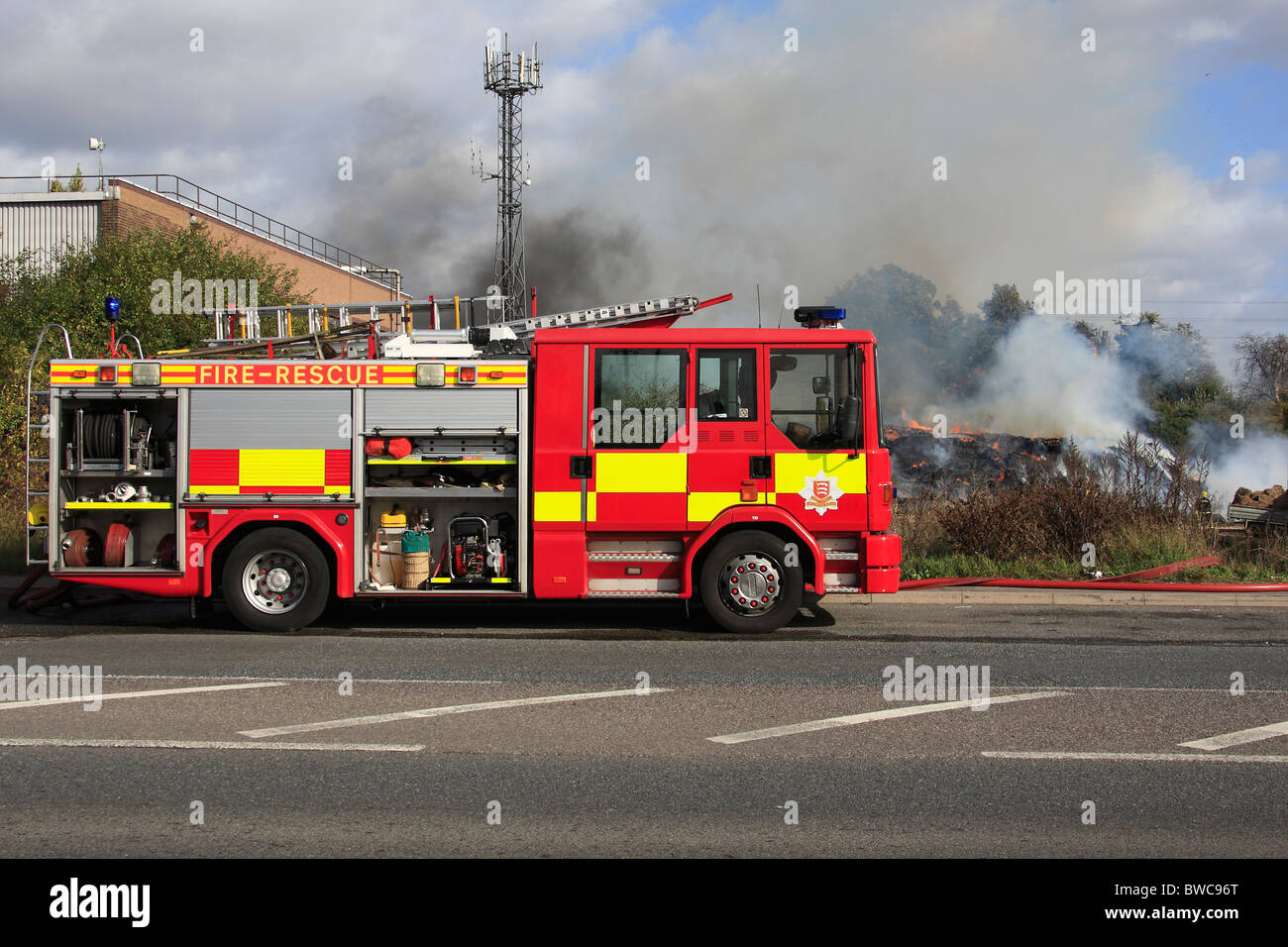 Fire engine at scene of a fire Stock Photo - Alamy