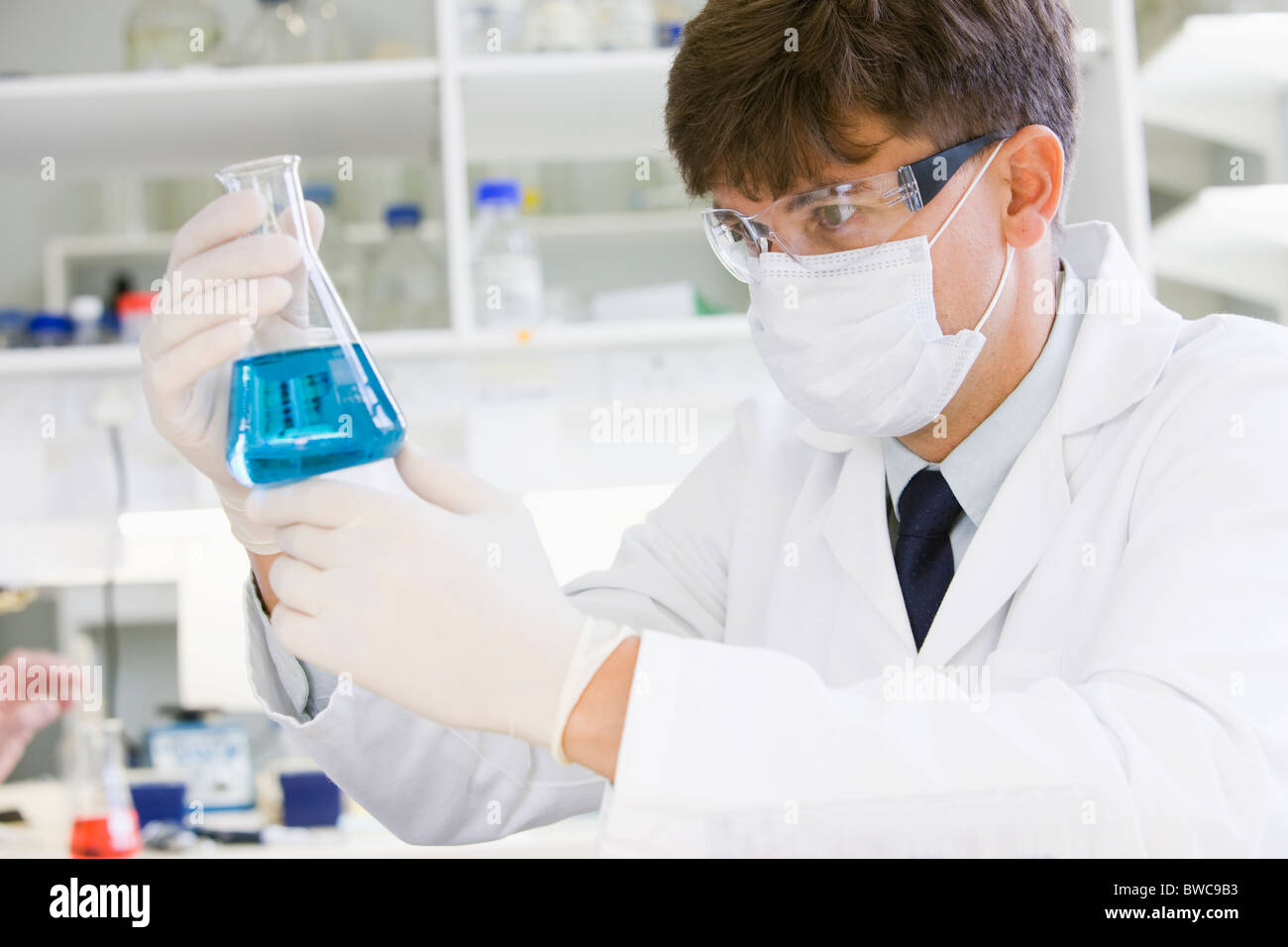Male scientist doing research in laboratory Stock Photo - Alamy