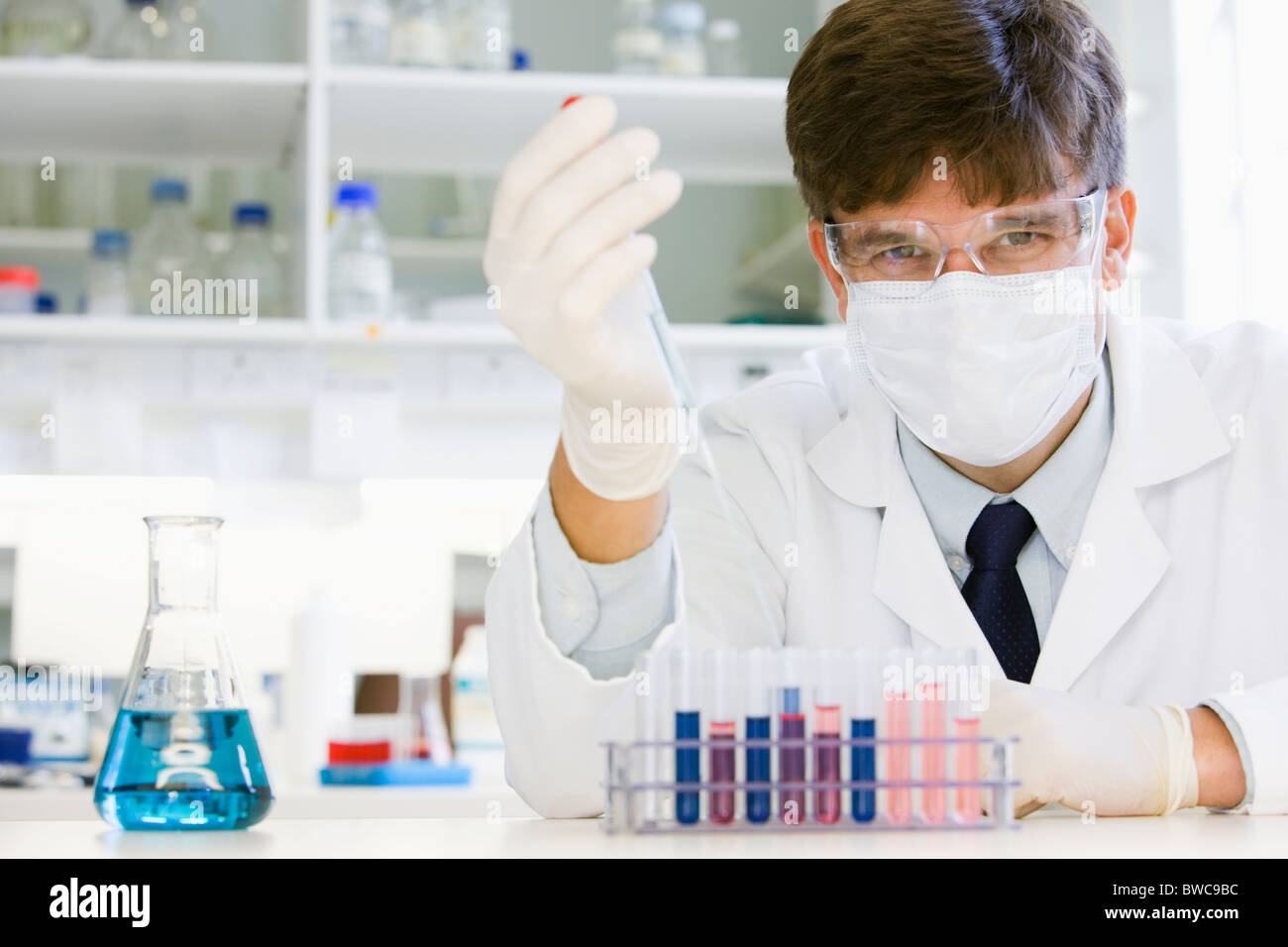 Male scientist doing research in laboratory Stock Photo - Alamy
