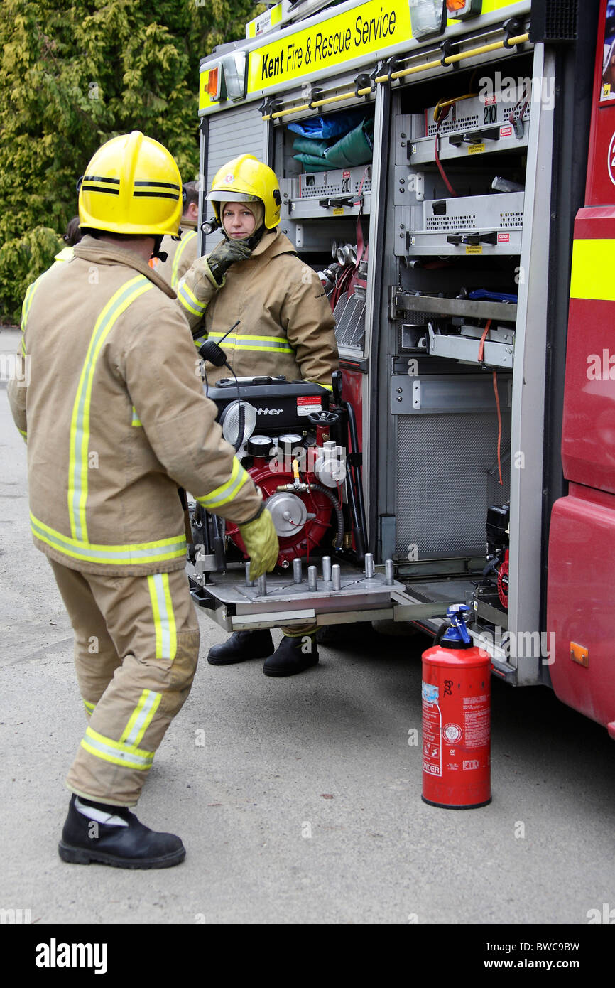 Kent firefighters with fire engine Stock Photo - Alamy