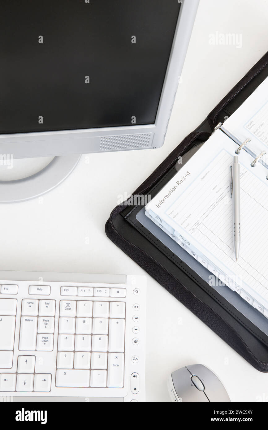 Computer and personal organizer on office desk, close-up Stock Photo ...