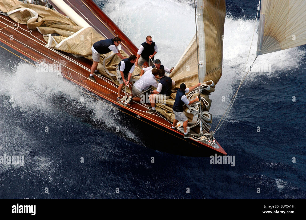 Foredeck crew attend to the sails as the J-Class yacht "Velsheda" races ...