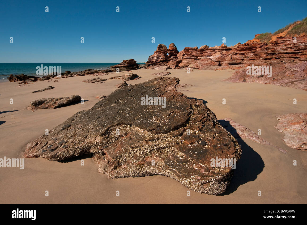 Large rock on a beach in the shape of Australia near Broome, Western ...