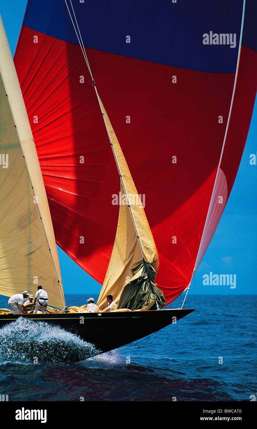 Foredeck crew aboard J-Class "Velsheda" lowering the jib as the yacht ...