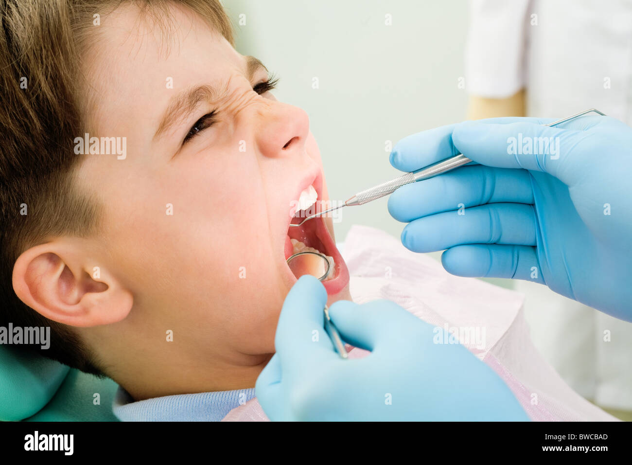 Dentist examining teeth children in hi-res stock photography and images ...
