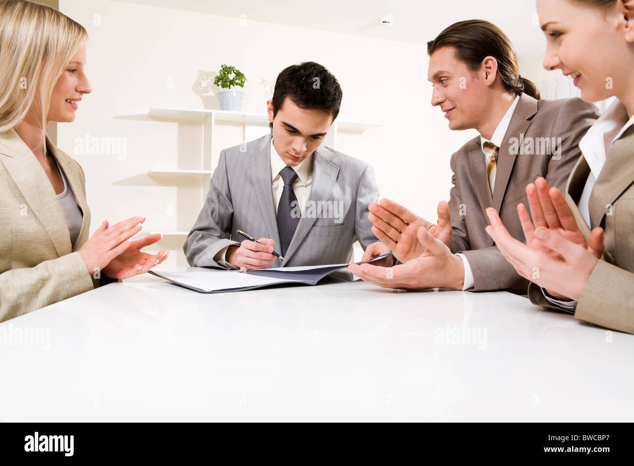 Photo of successful businessman signing contract with promising company ...