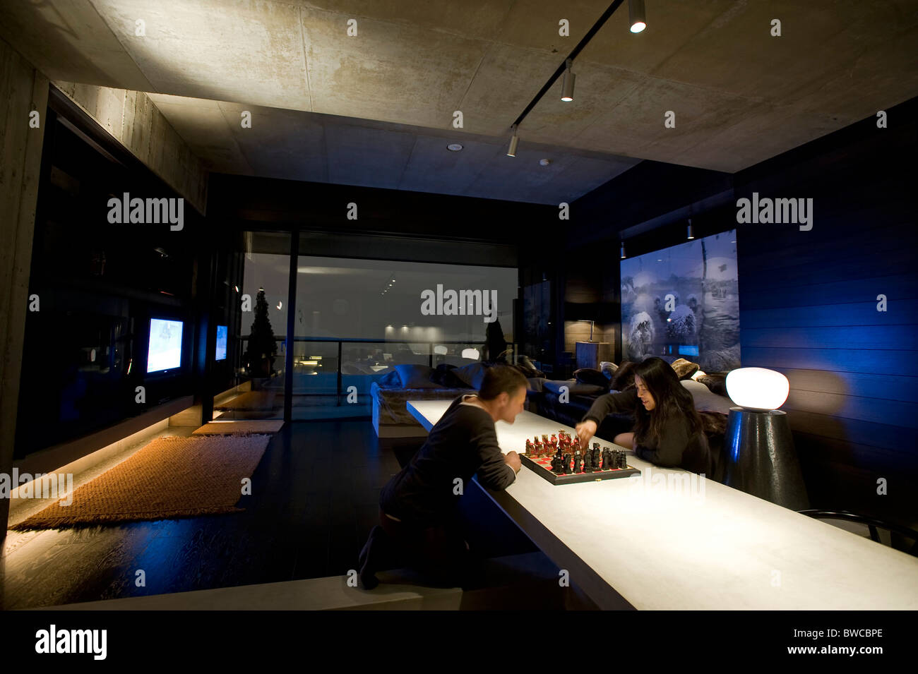 Photo shows the living room of a loft at Suiboku Lofts in Hirafu ...