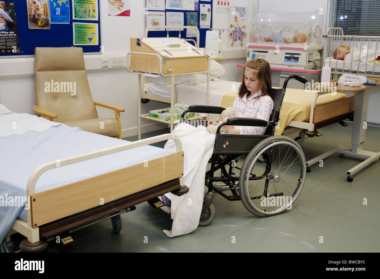 Young sick girl patient in a wheelchair in a hospital ward Stock Photo ...