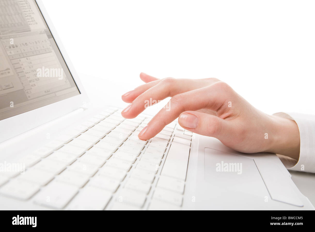Side view of female hand pressing key of white laptop keypad Stock ...