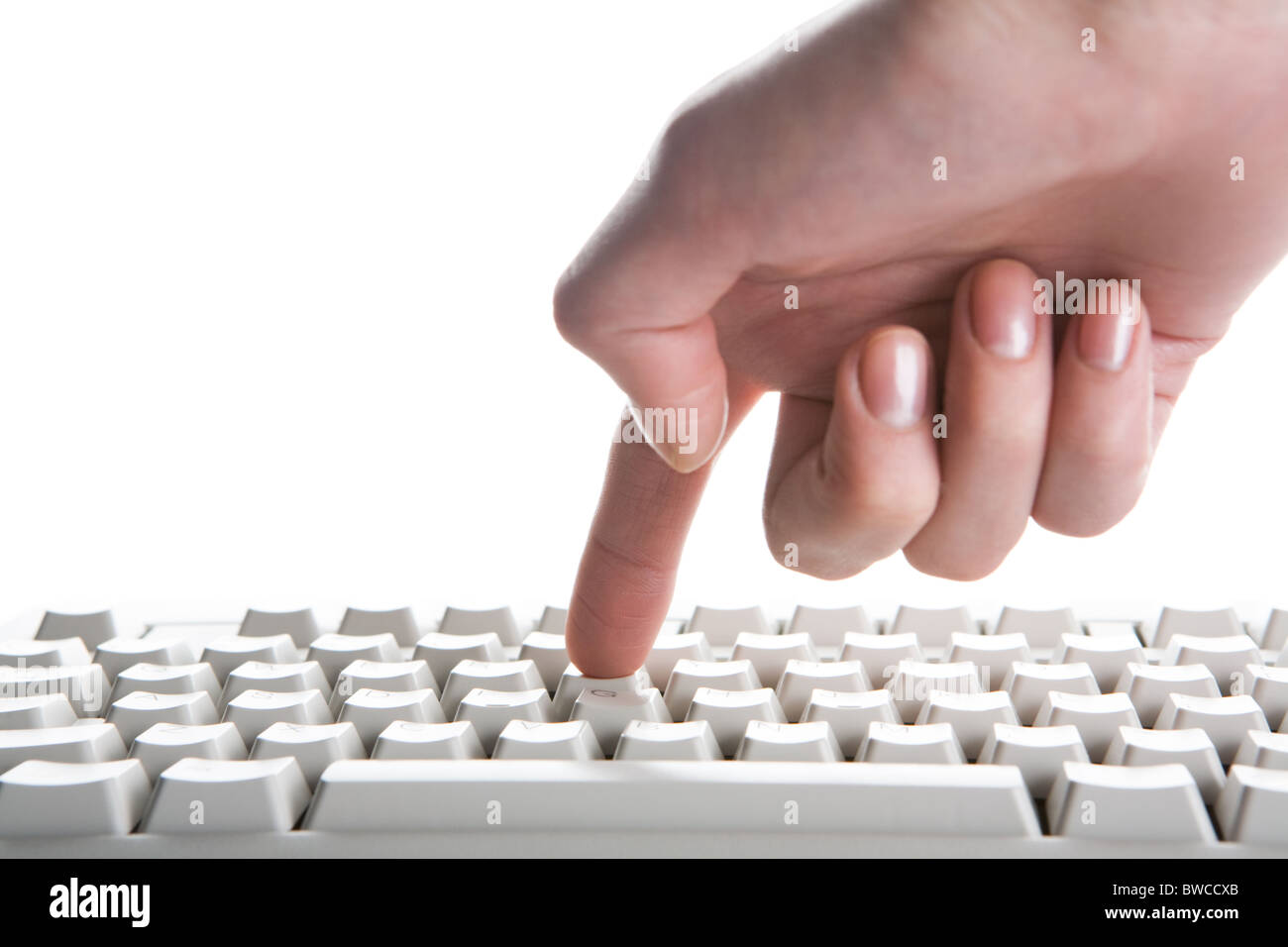 Image of human forefinger on keyboard button over white background ...