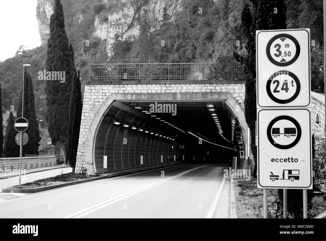 lit tunnel with road and traffic signs Stock Photo - Alamy